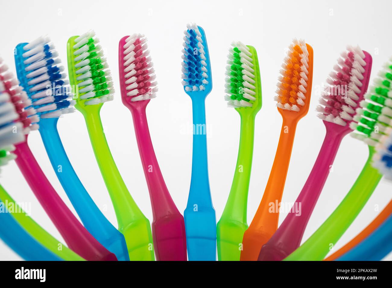 Many different colored toothbrushes in toothbrush cup, detail, symbol ...