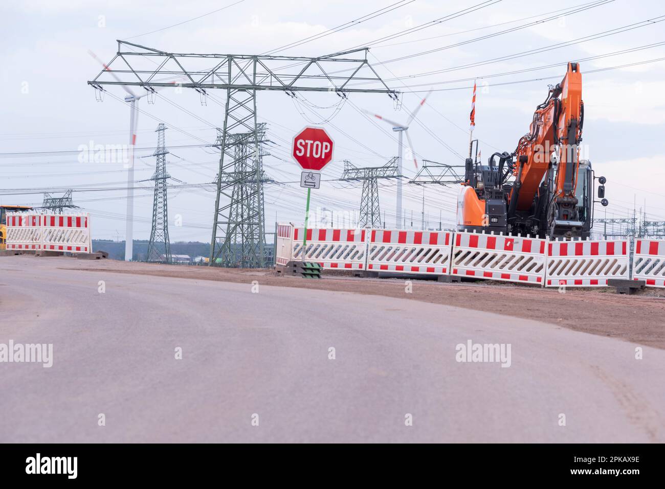 Power pylons, excavator, Southeast Link construction site, Wolmirstedt ...