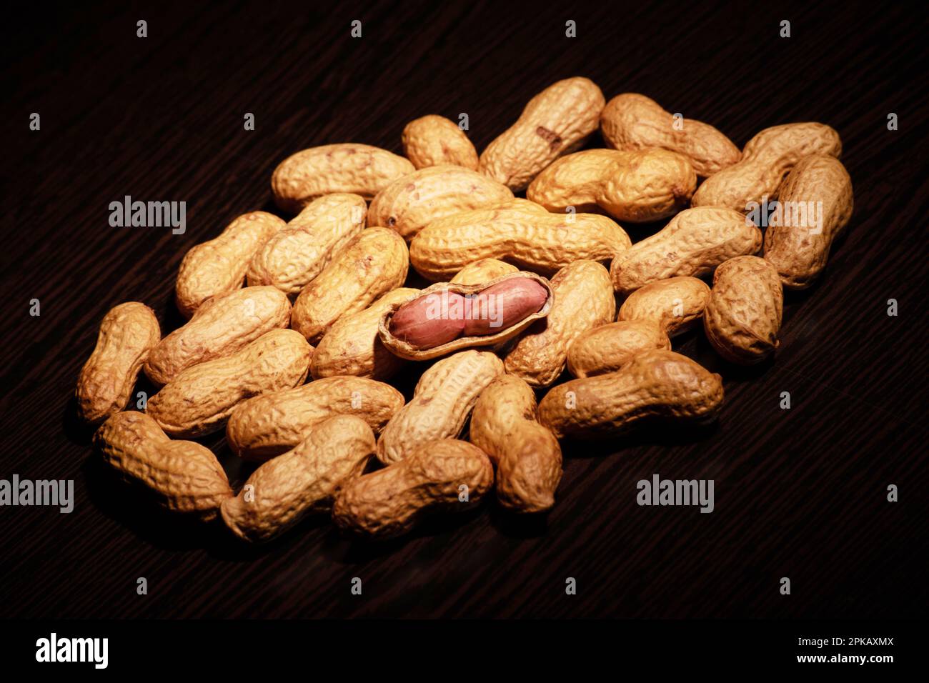 Roasted peanut with shelf on the table Stock Photo - Alamy