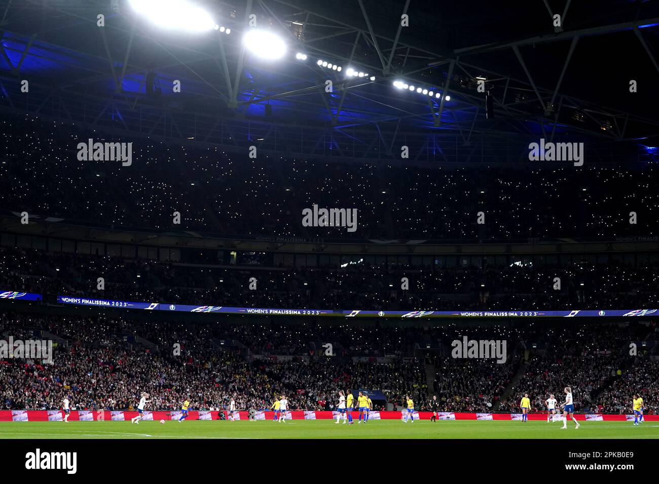 A general view of fans in the stands displaying their phone lights ...