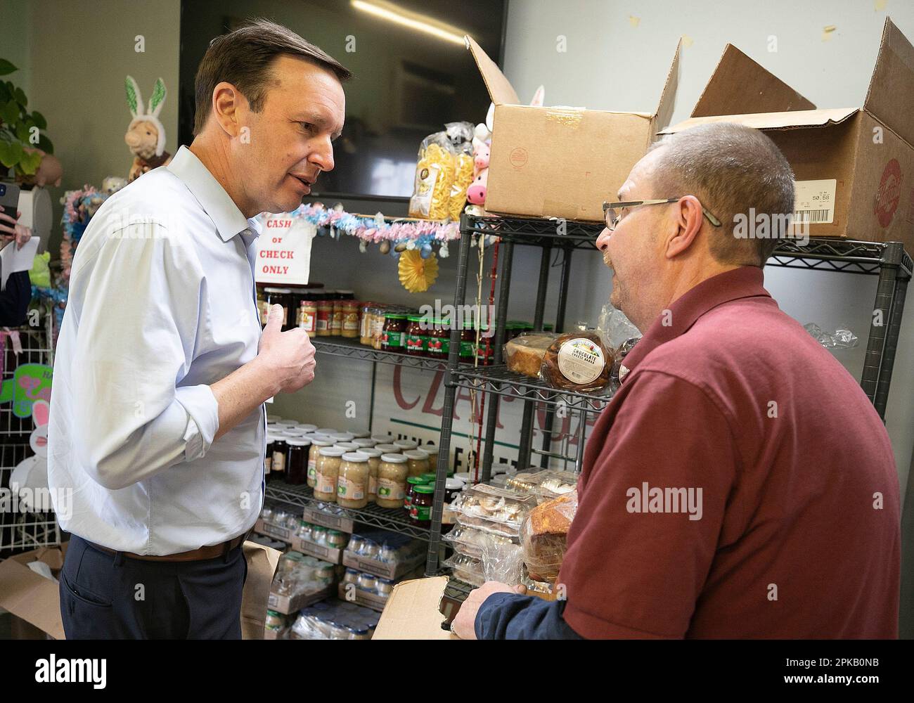 Sen. Chris Murphy, D-Conn., talks with Walter Paluszewski, co-owner of ...