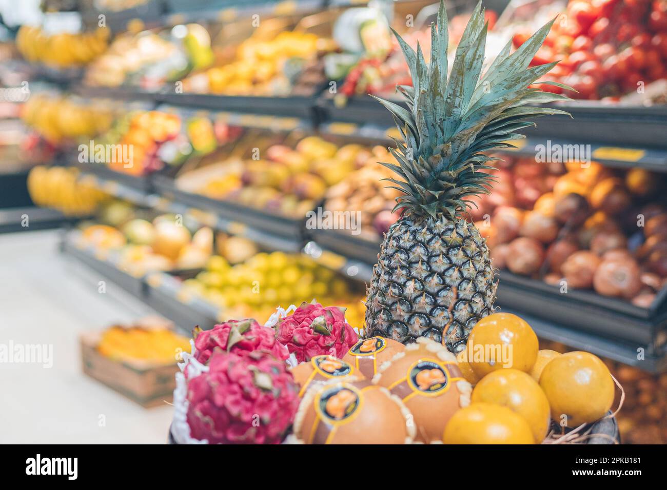 Horizontal close-up photo of exotic fruits such as pineapples, pears ...