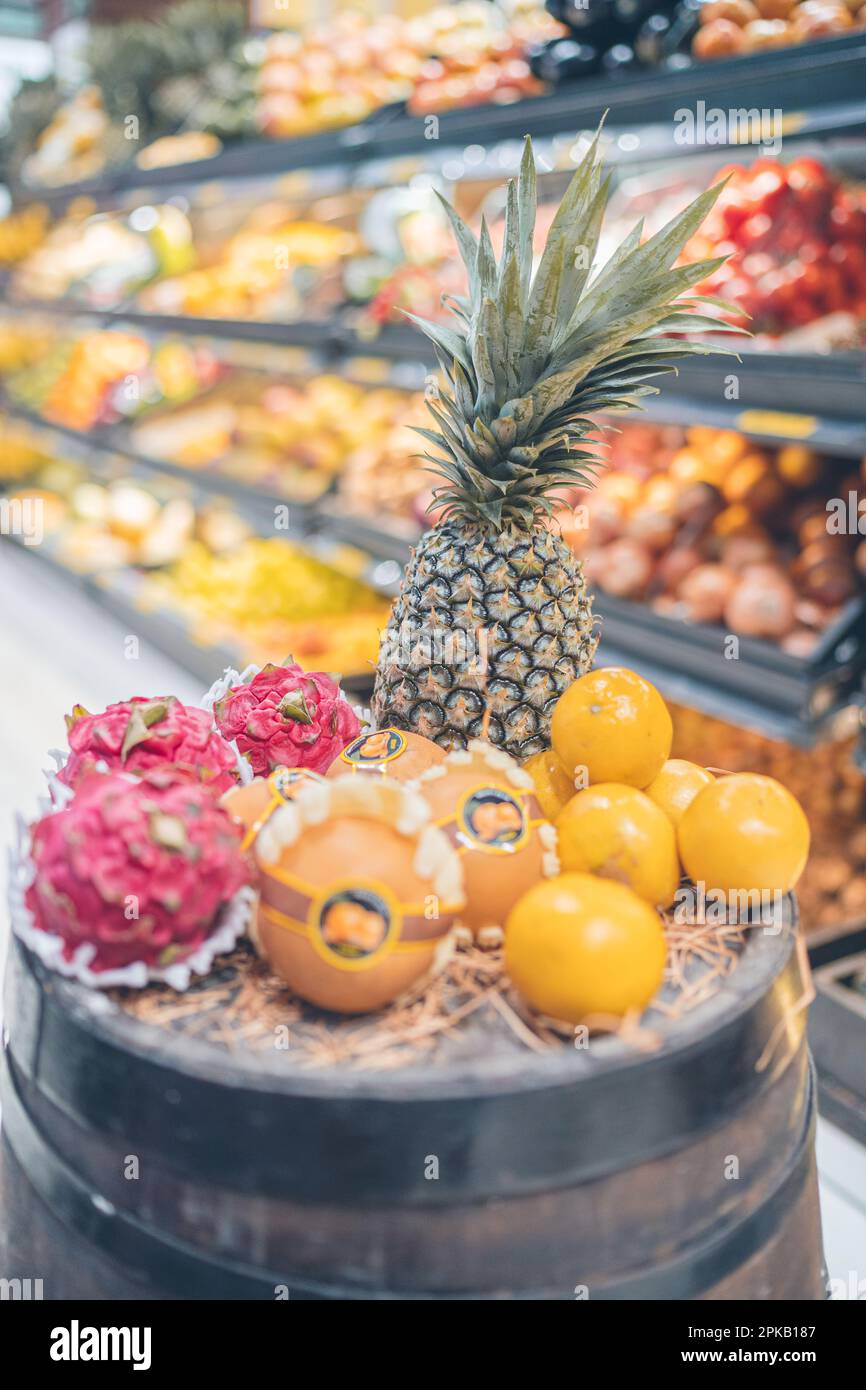 Vertical close-up photo of exotic fruits such as pineapples, pears ...