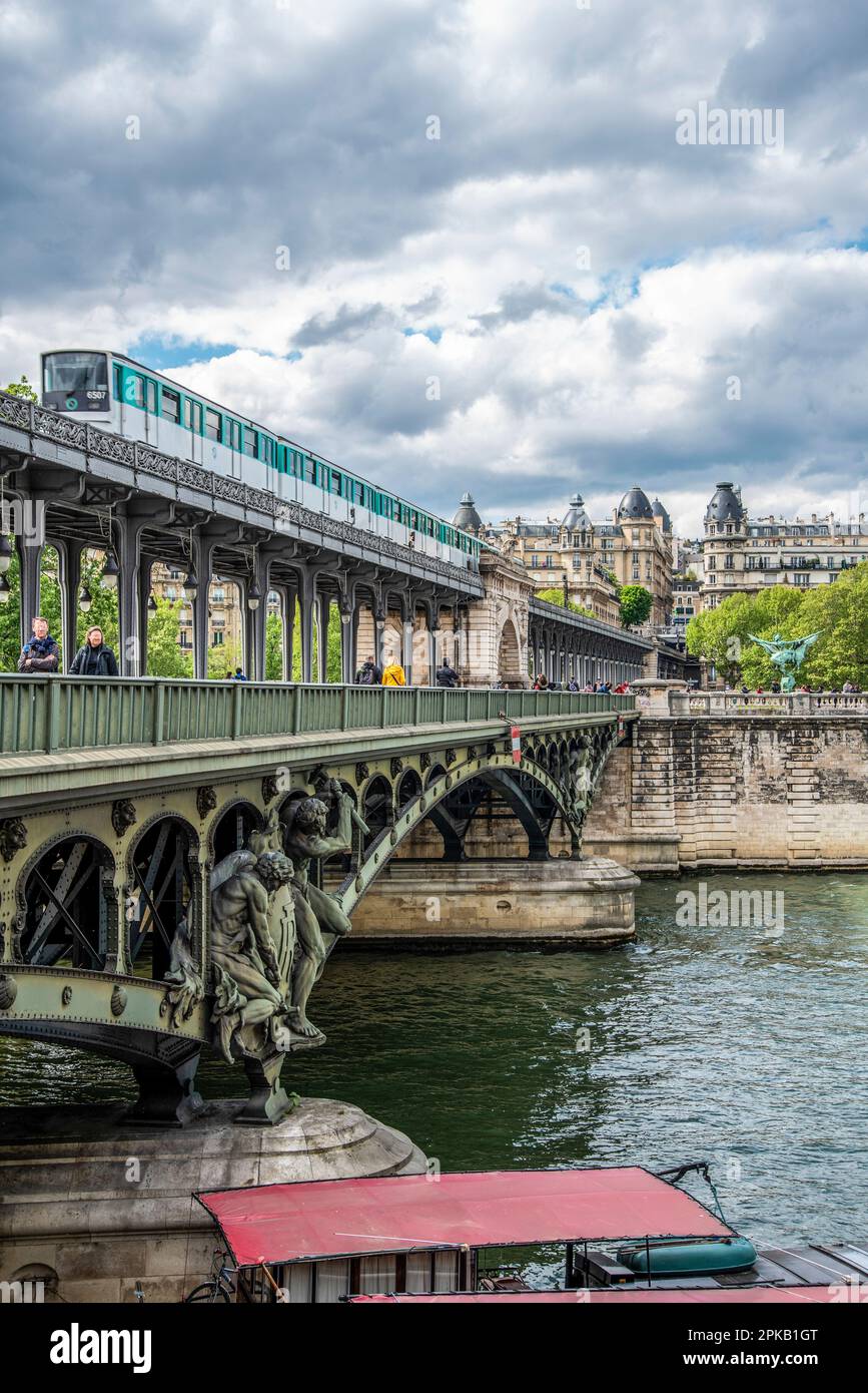 A metro crossing the bridge Bir Hakeim over the Seine in Paris, France ...