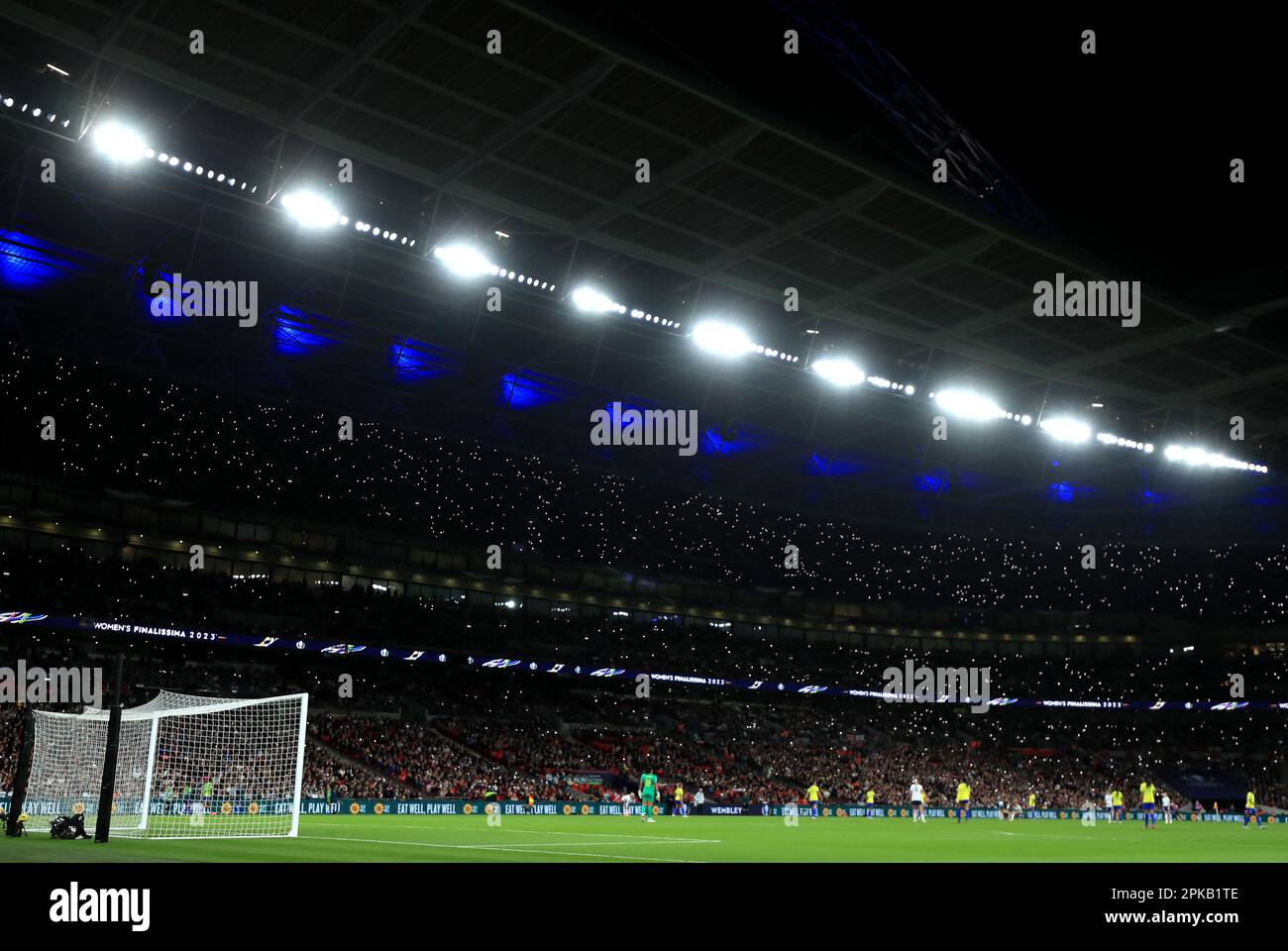 A general view of fans in the stands displaying their phone lights ...