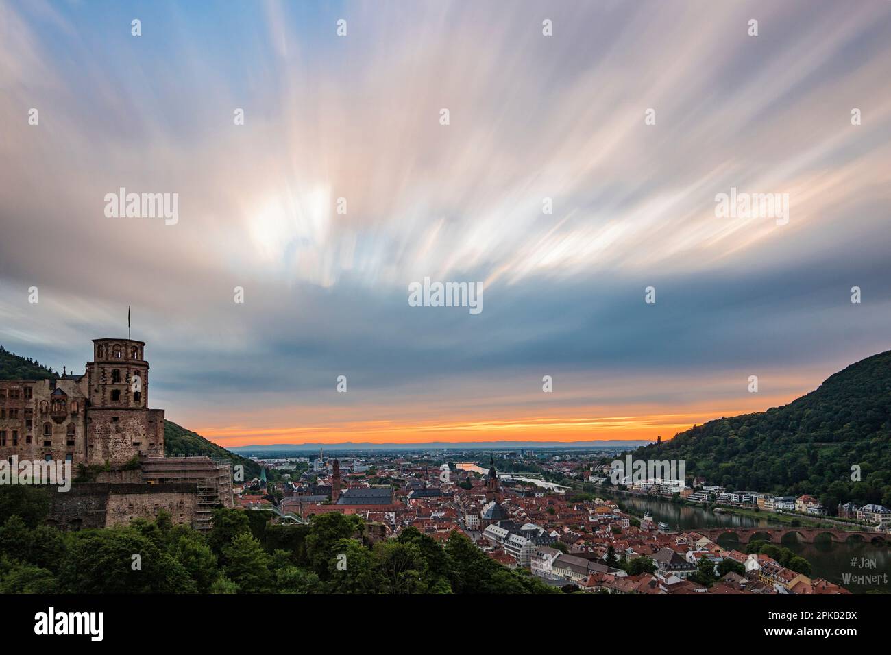 View over Heidelberg with castle and great sunrise, clouds in the sky ...