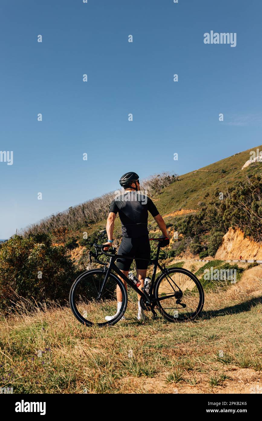 Bicycle rider standing hi-res stock photography and images - Alamy