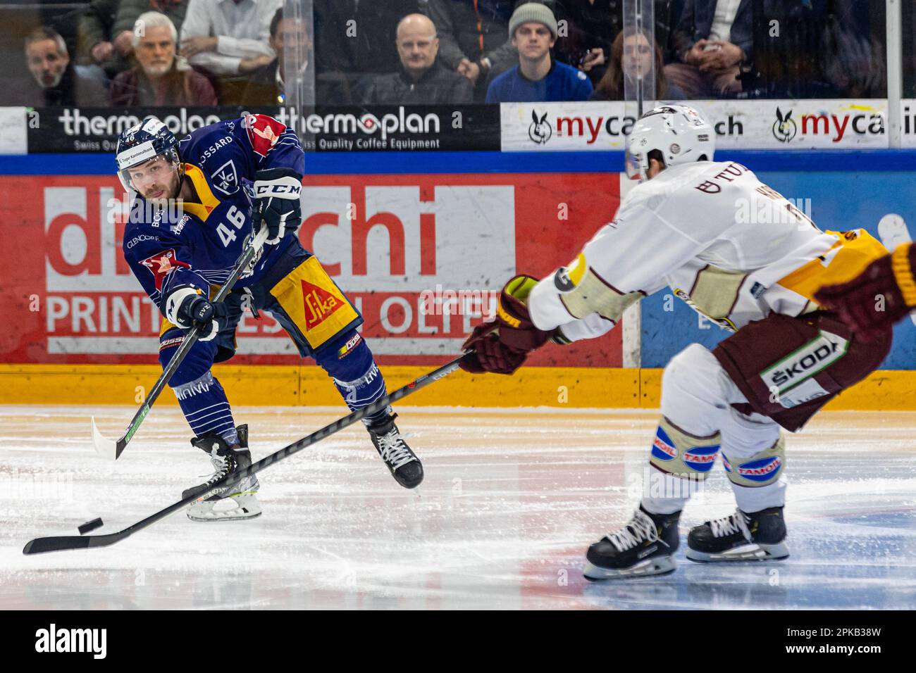 Lino Martschini #46 (EV Zug) plays a pass through the Geneva box during ...