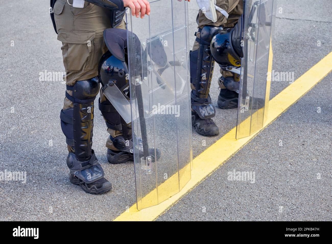 Military police officers members lined up with protective gear ...