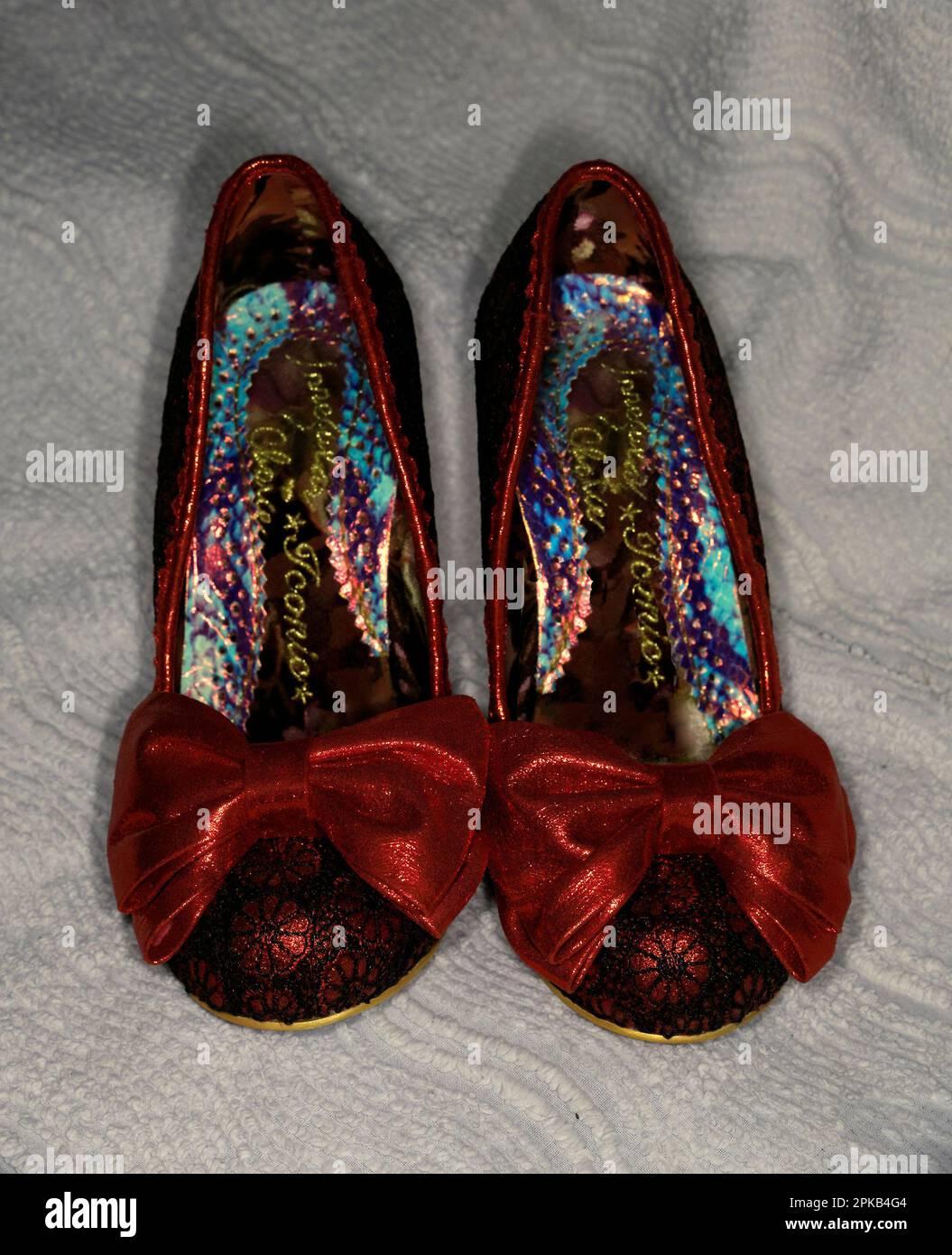 Red shoes with bows, red lace on black Stock Photo - Alamy