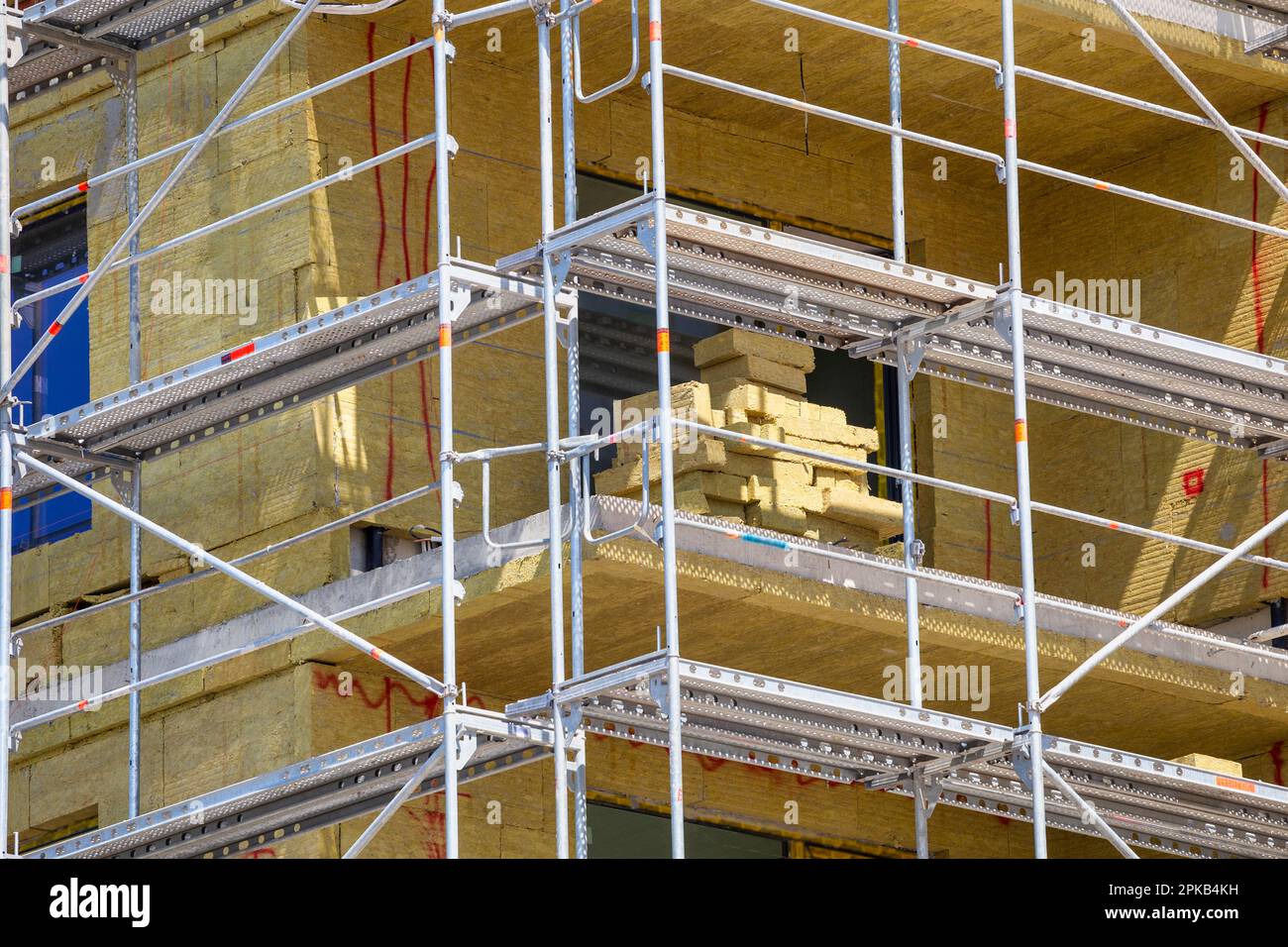 Mineral wool insulation with scaffolding arround. External wall thermal ...