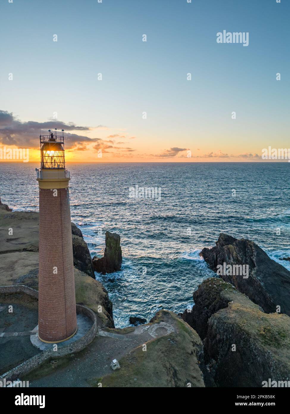 Sunset over Butt of Lewis Lighthouse on the Isle of Lewis in the Outer ...