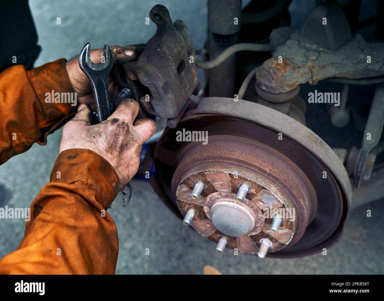 Car rusty brake rotor in automobile workshop photo with mechanic hands ...
