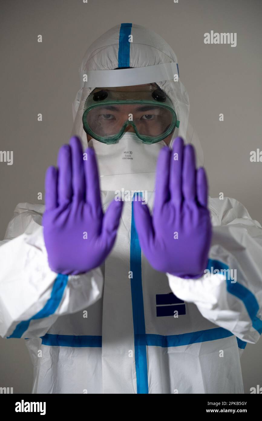 Man in protective suit during the Covid-19 pandemic Stock Photo - Alamy