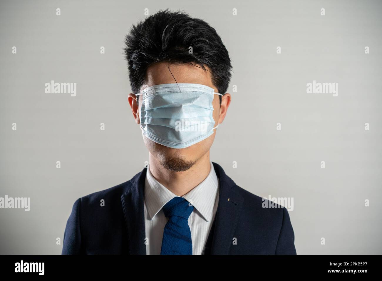 Man wearing a mask over his eyes Stock Photo - Alamy