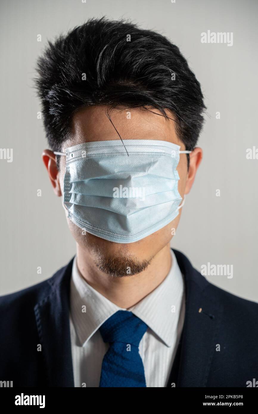 Man wearing a mask over his eyes Stock Photo - Alamy