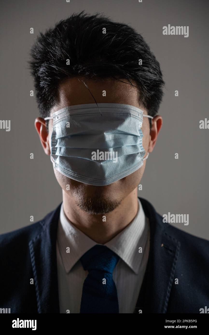 Man wearing a mask over his eyes Stock Photo - Alamy