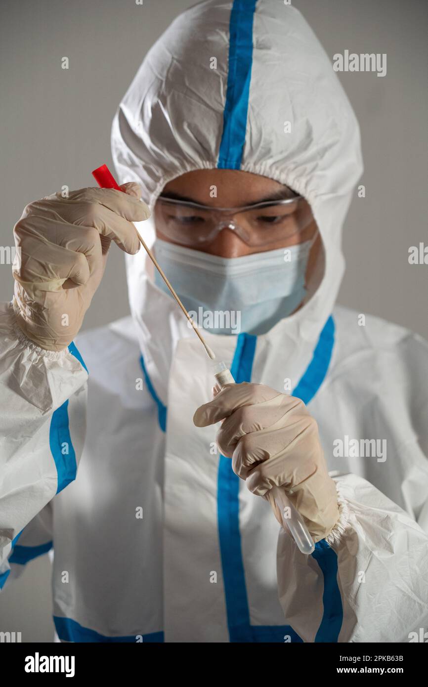 Medical personnel performing an antigen test for covid-19 Stock Photo ...