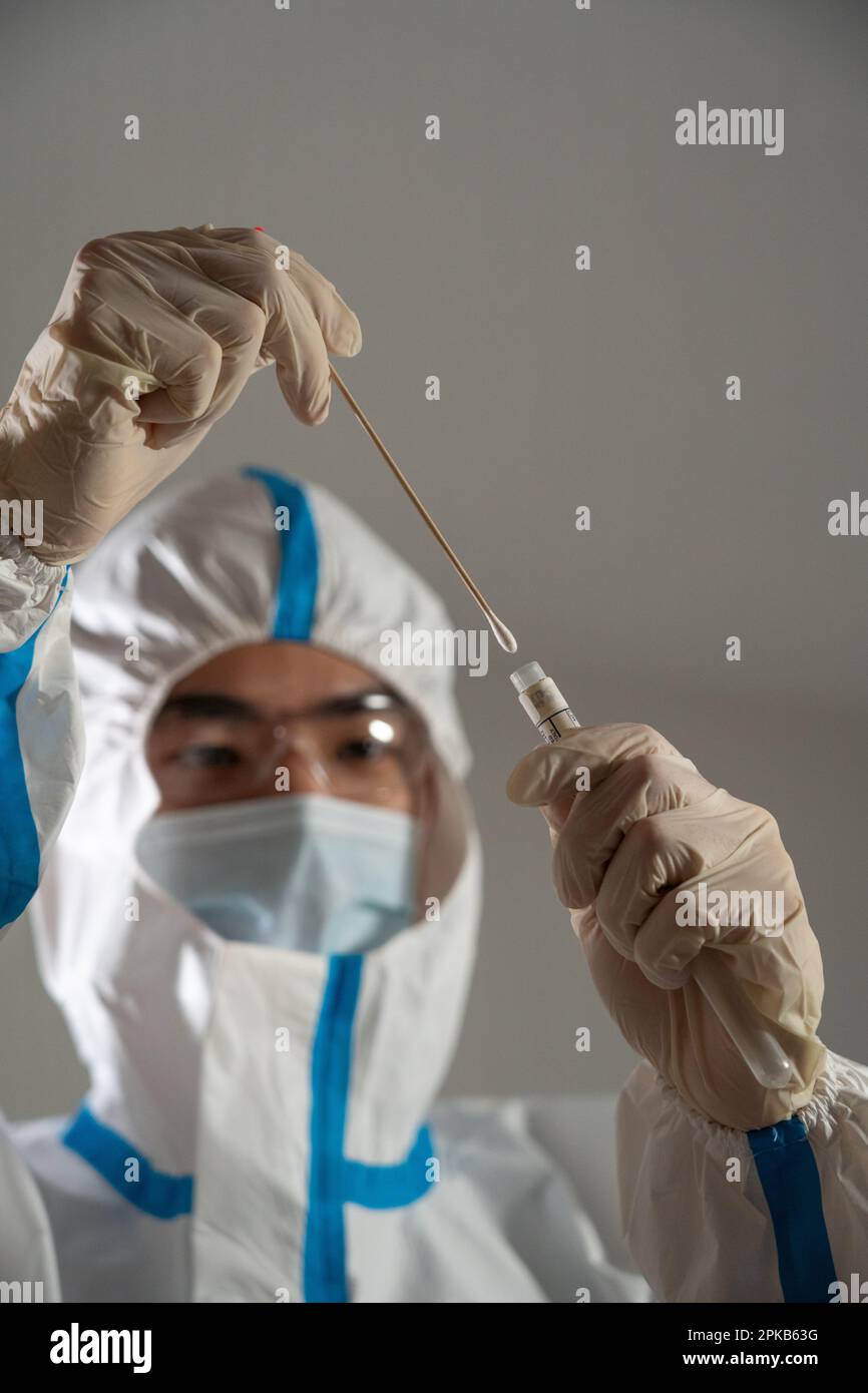 Medical personnel performing an antigen test for covid-19 Stock Photo ...