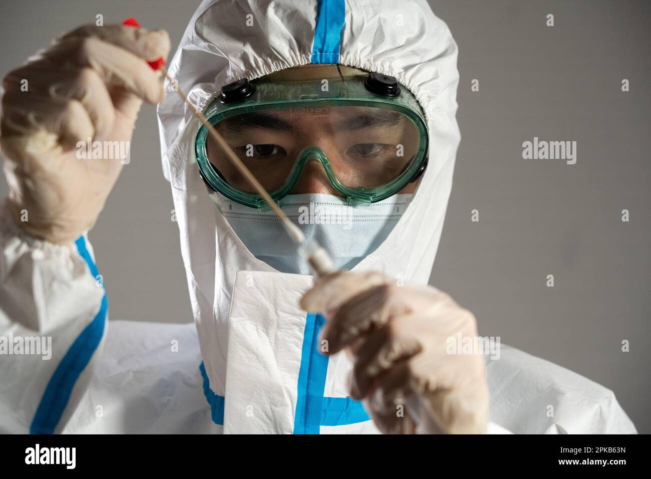 Medical personnel performing an antigen test for covid-19 Stock Photo ...