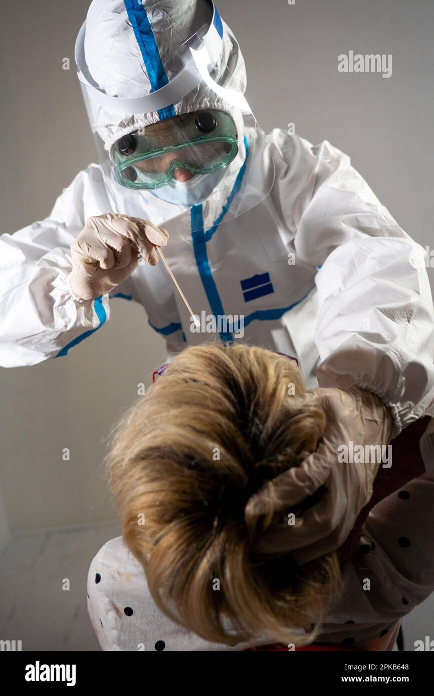 Medical personnel performing an antigen test for covid-19 Stock Photo ...