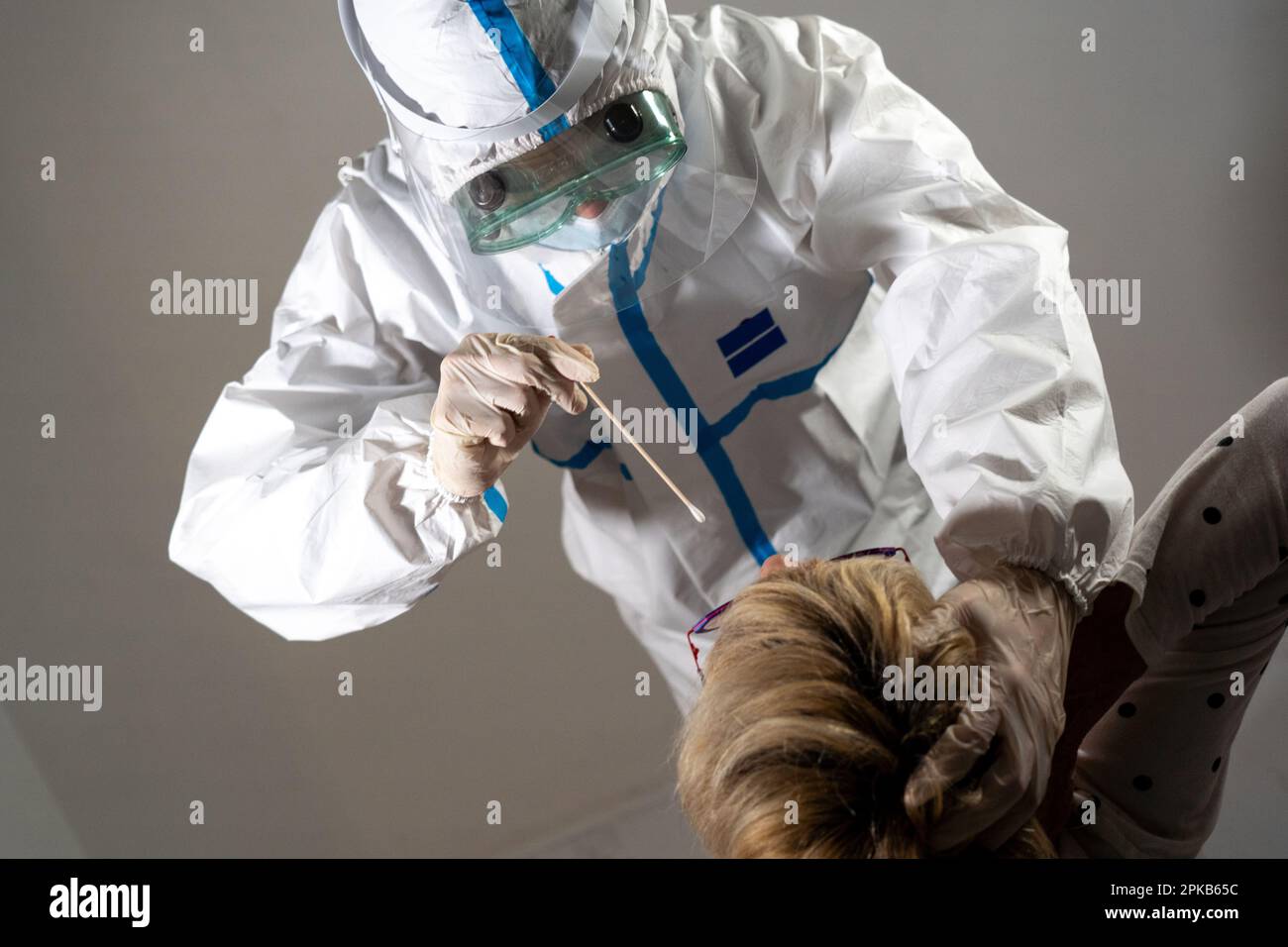Medical personnel performing an antigen test for covid-19 Stock Photo ...