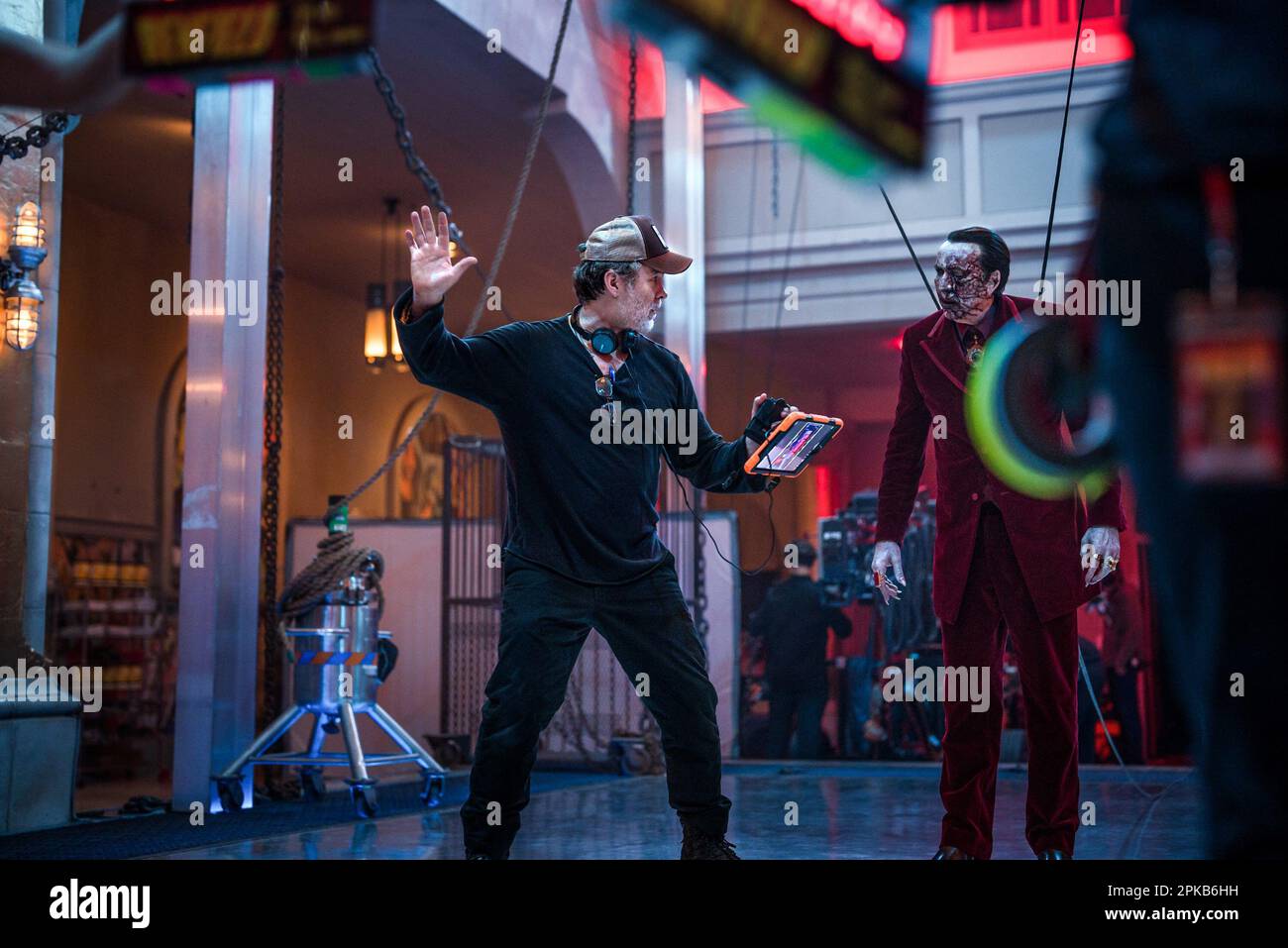 RENFIELD, from left: director Chris McKay, Nicolas Cage, on set, 2023 ...