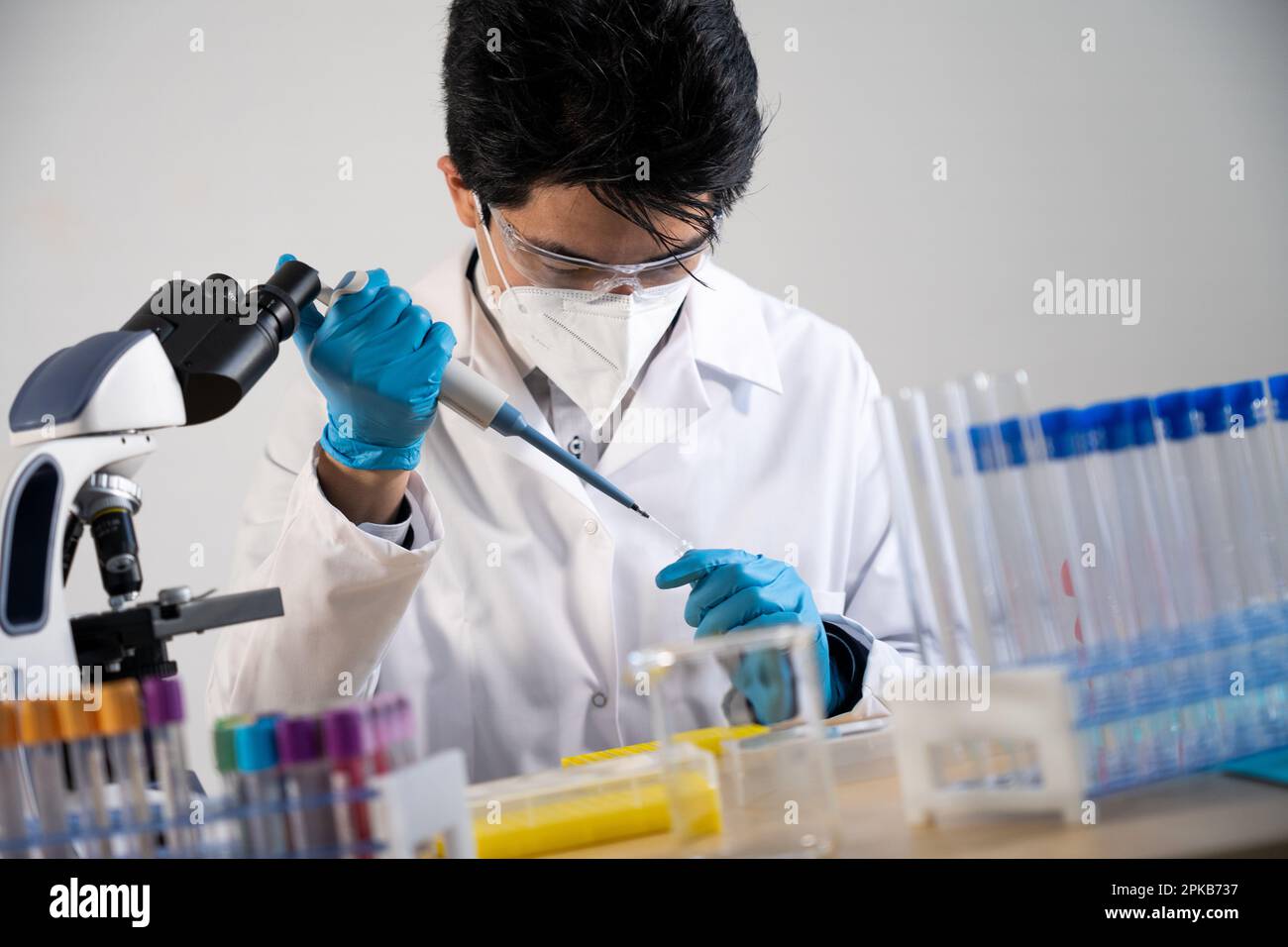 Laboratory assistant conducting experiments for laboratory research ...