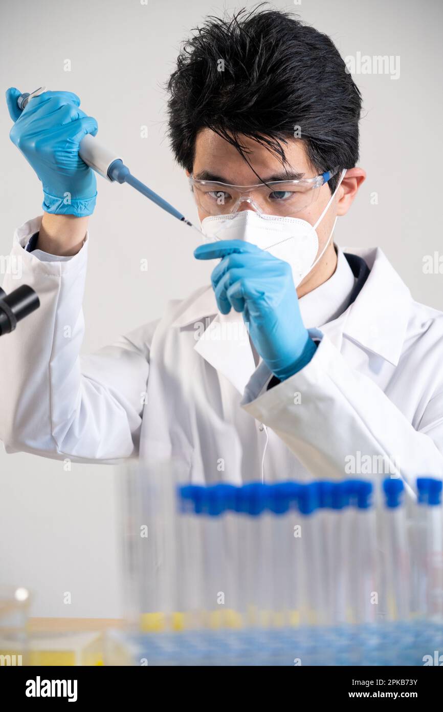 Laboratory assistant conducting experiments for laboratory research ...