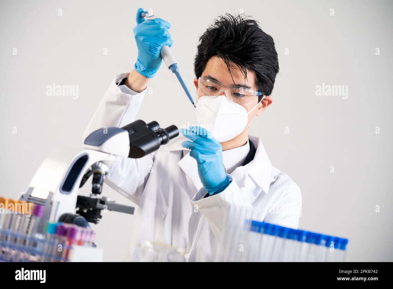 Laboratory assistant conducting experiments for laboratory research ...