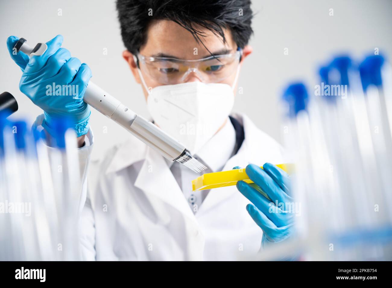 Laboratory assistant conducting experiments for laboratory research ...