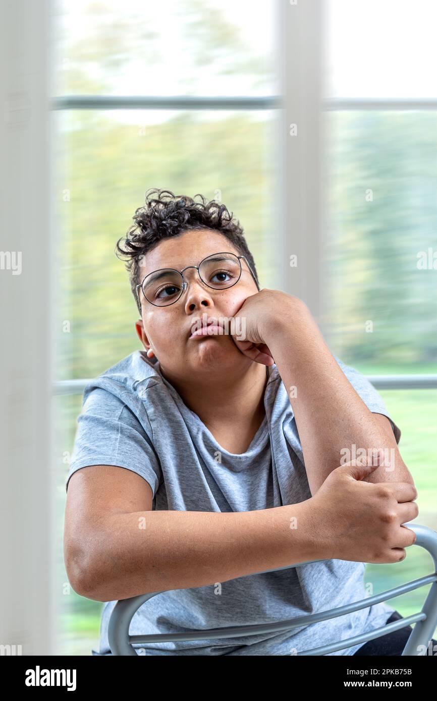 Front view teenager showing signs of weariness Stock Photo - Alamy