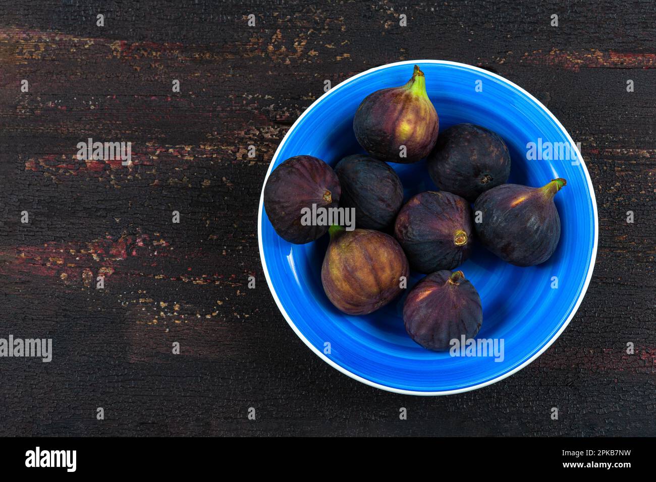 Black figs rich in minerals and trace elements in a blue plate Stock ...