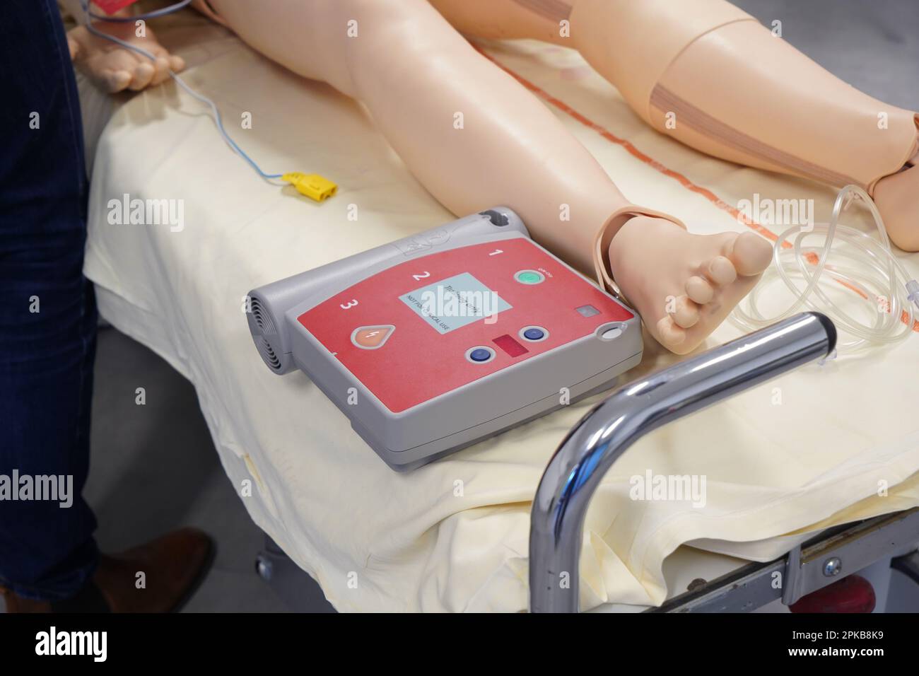 Resuscitation training on a dummy with a defibrillator Stock Photo - Alamy