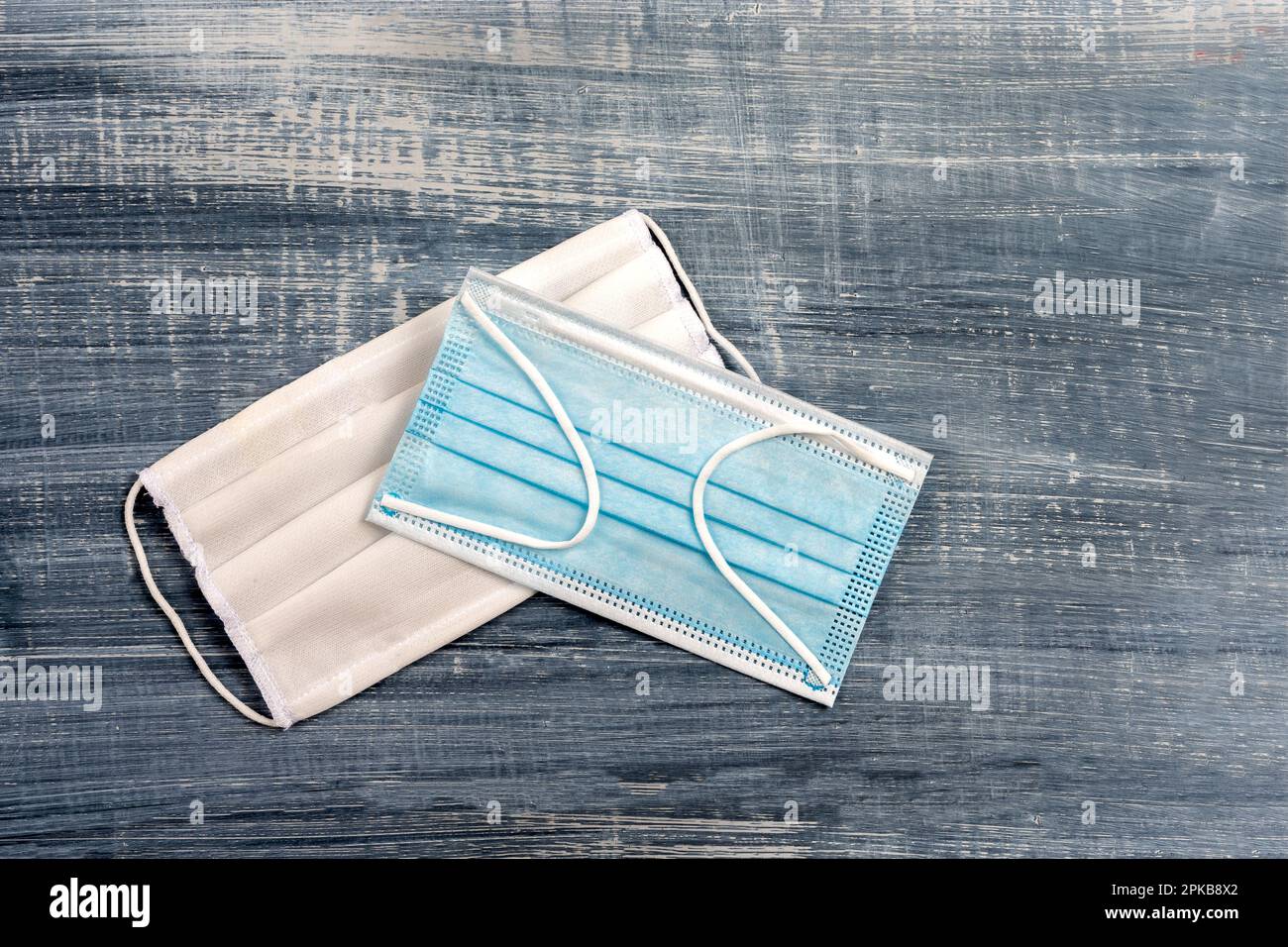 Two different masks top view on gray background Stock Photo - Alamy