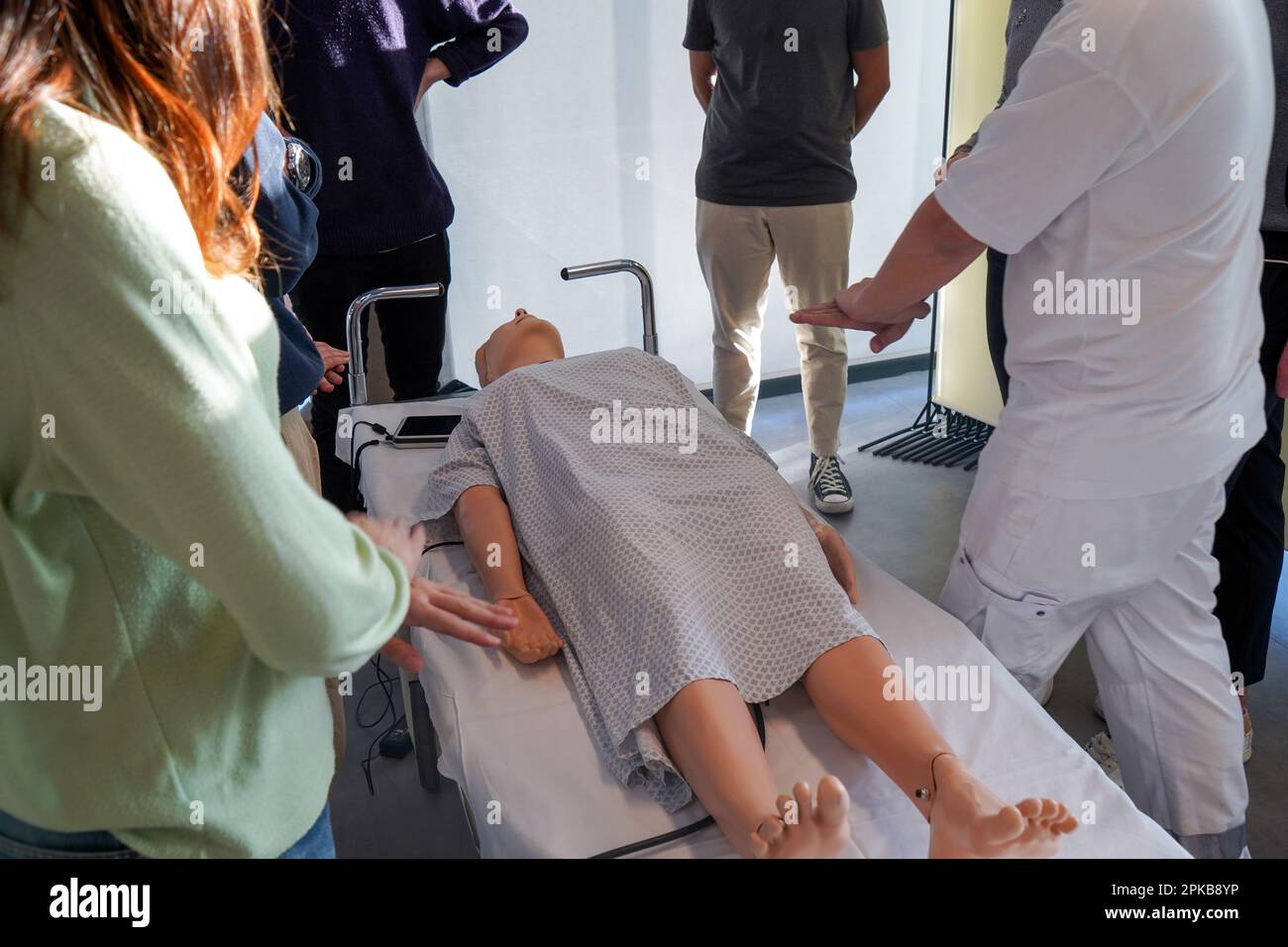 5th year medical students during a SimMan dummy cardiac massage ...