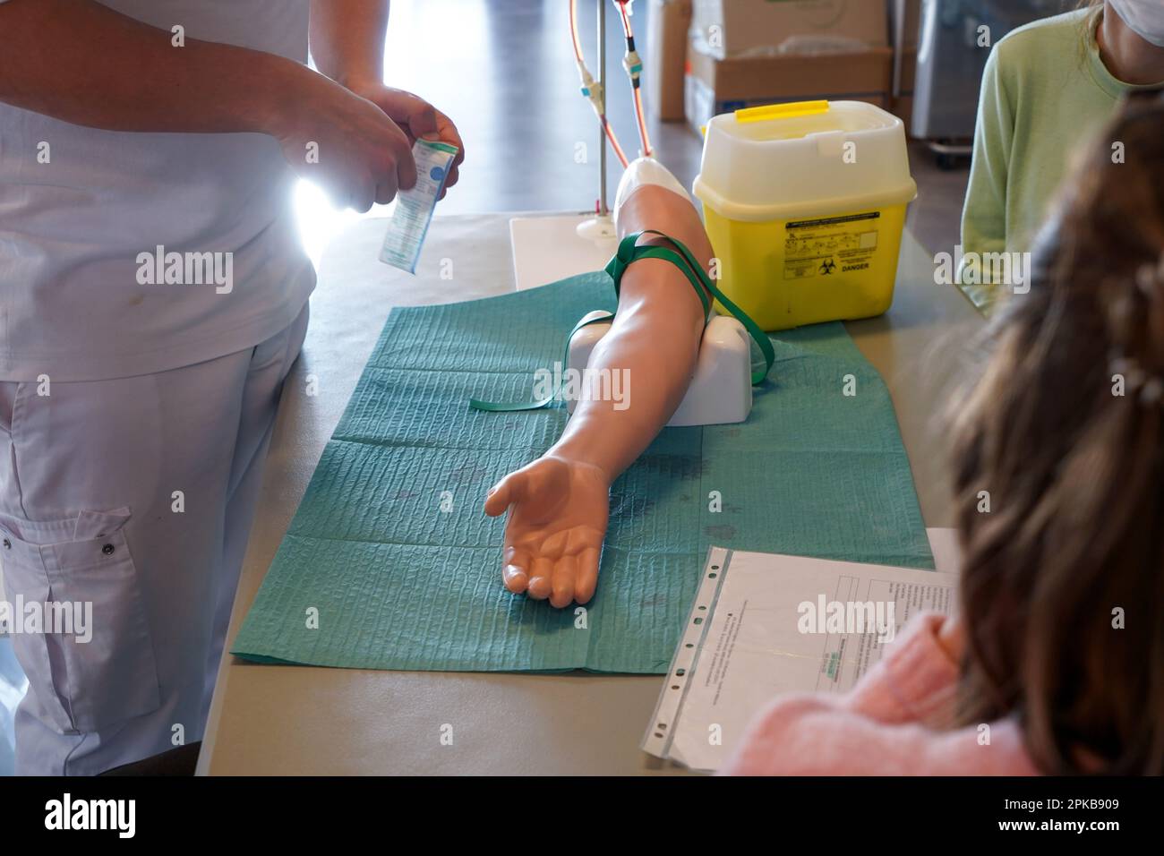 5th year medical students during an IV placement workshop. Students ...