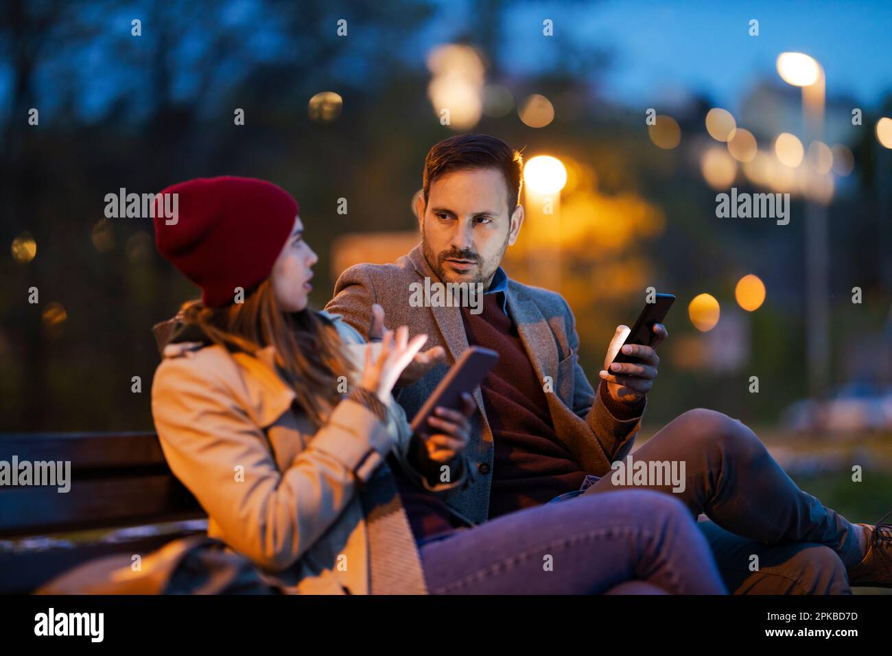 Portrait of young couple outdoor on street having relationship problems ...