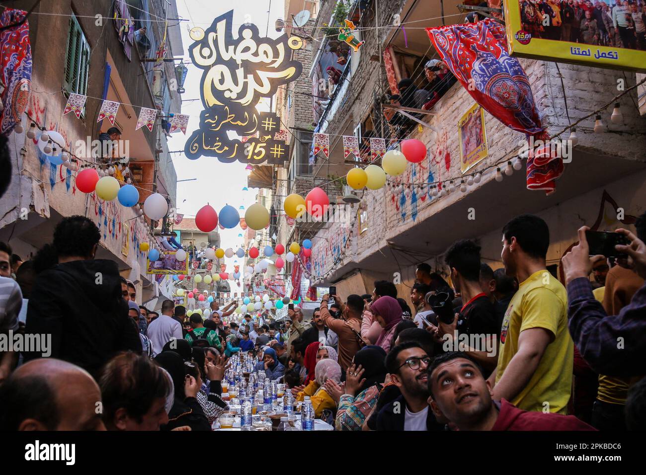 Cairo, Egypt. 06th Apr, 2023. People attend a mass Iftar gathering ...