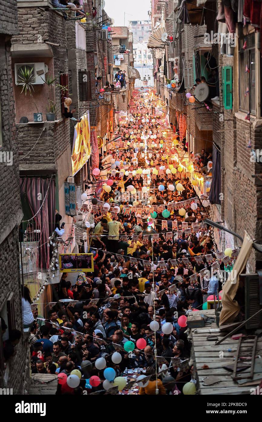 Cairo, Egypt. 06th Apr, 2023. People attend a mass Iftar gathering ...