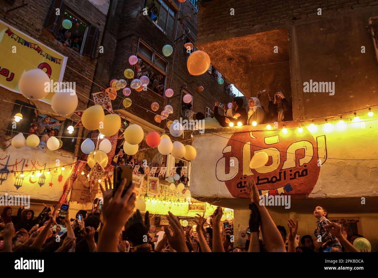 Cairo, Egypt. 06th Apr, 2023. People celebrate after the mass Iftar ...