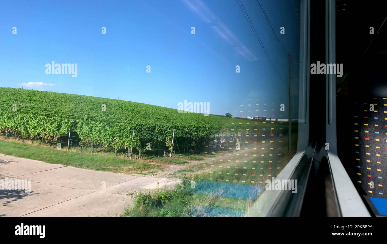 Passenger view looking out window from a moving train. Daydreaming feel ...