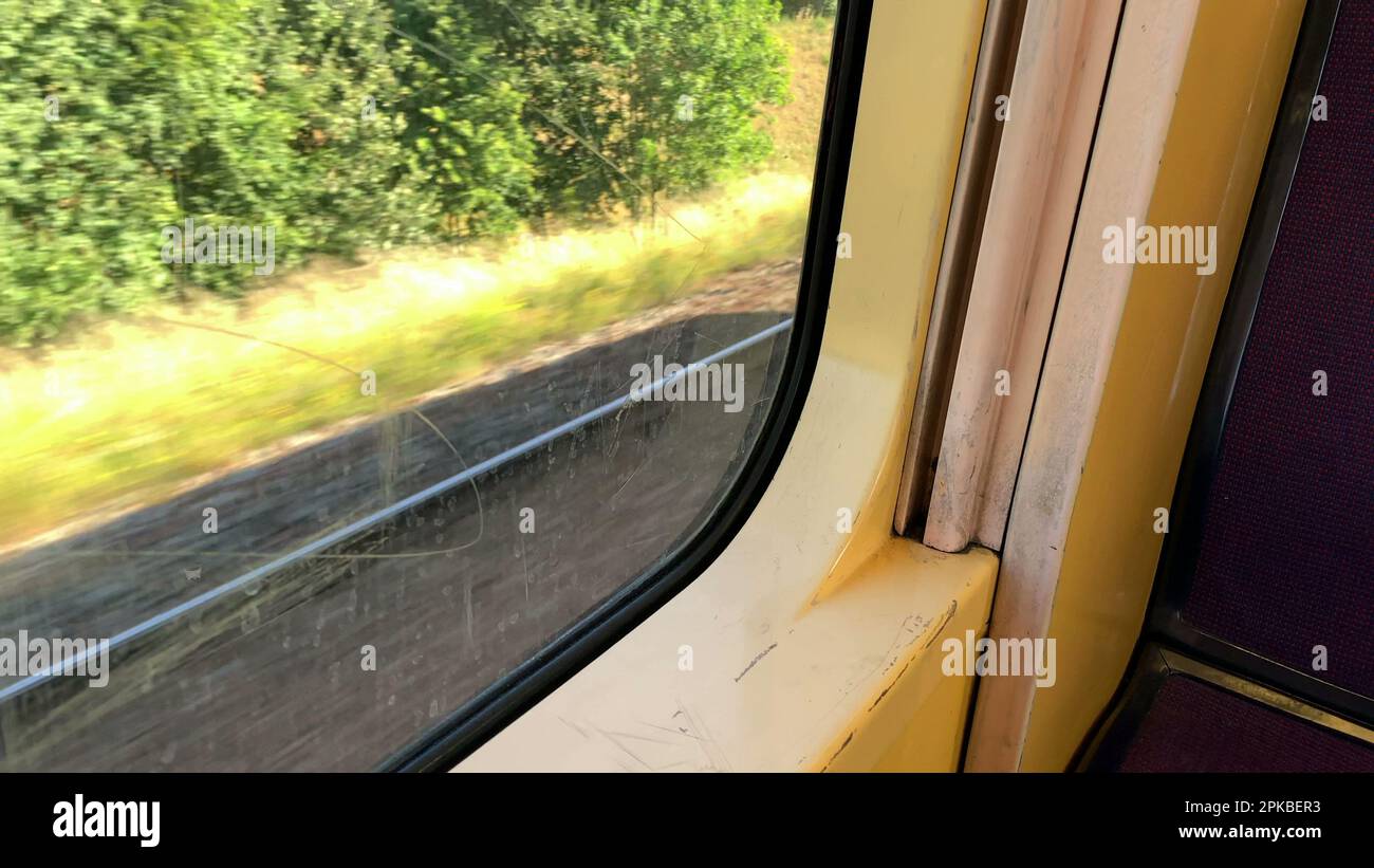 Passenger perspective on a moving train looking outside window Stock ...