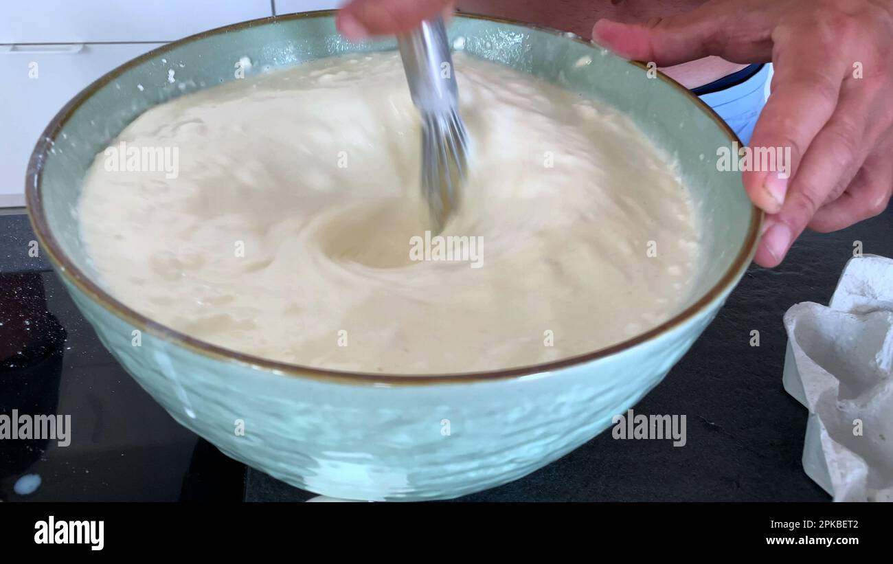 Hand mixing ingredients flour in hi-res stock photography and images ...