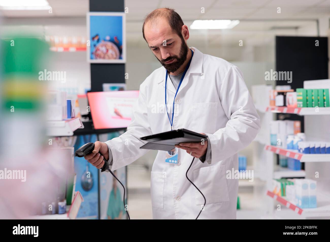 Pharmacist scanning medication scanner hi-res stock photography and ...