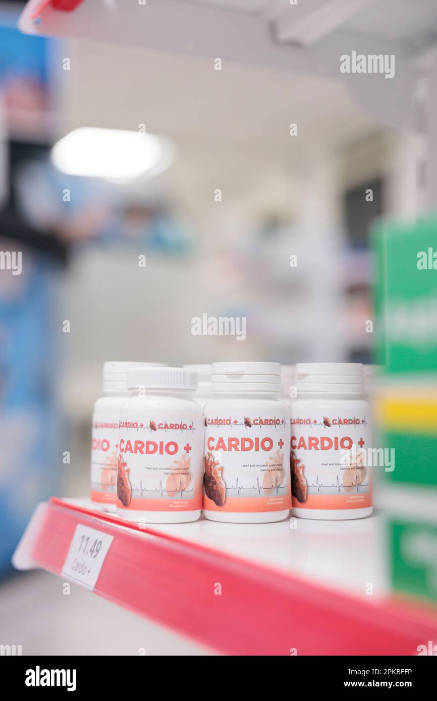 Cardiology pills bottle standing on drugstore shelves ready for clients ...