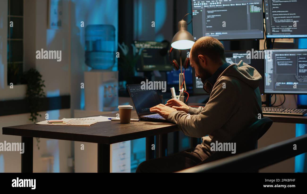 Database Programmer Typing Server Code On Multiple Screens Using Coding Language On Laptop Late