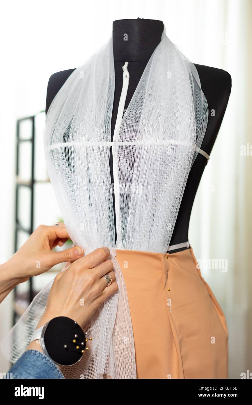 Female dressmaker using fabric hi-res stock photography and images - Alamy