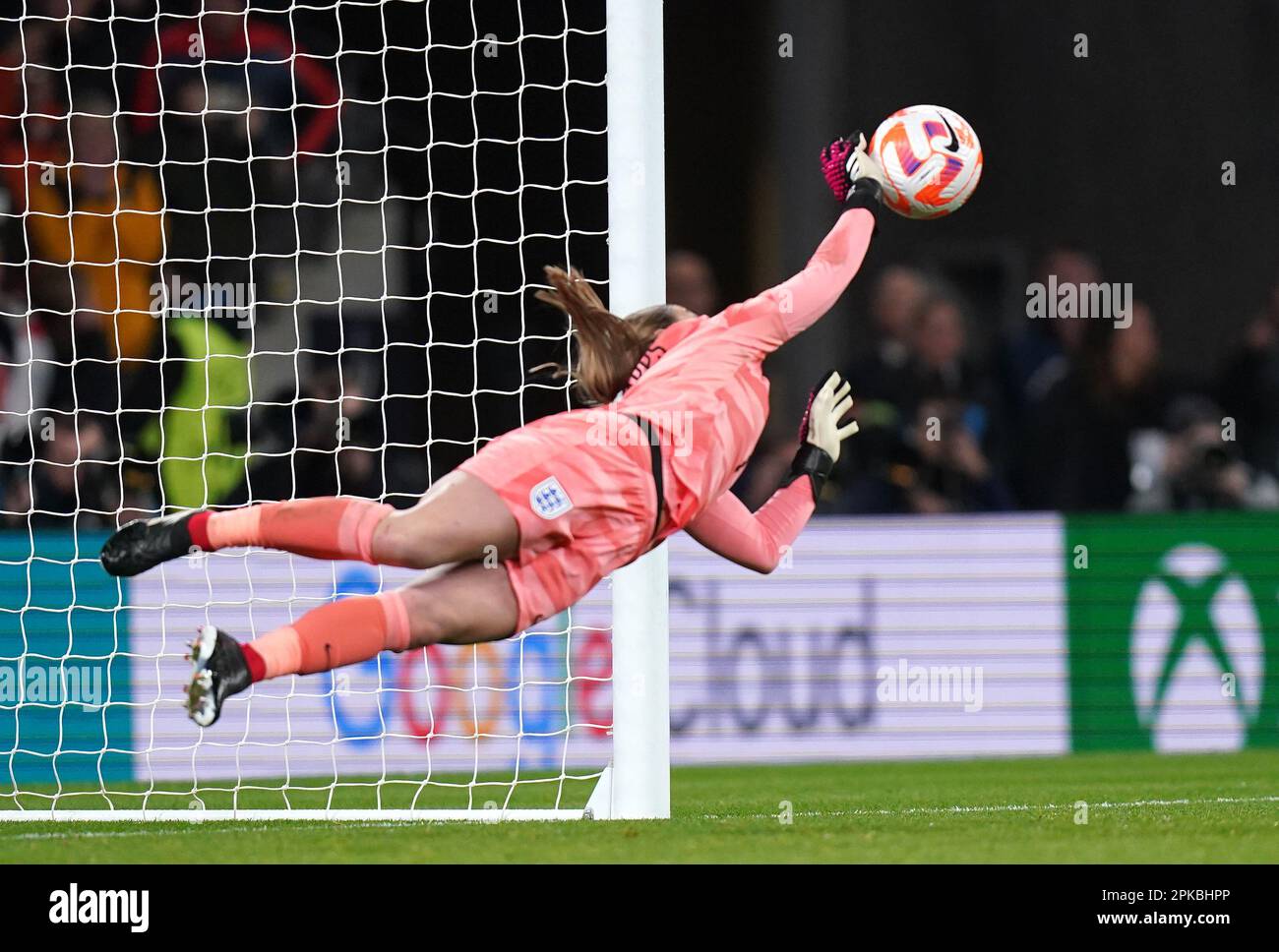 England goalkeeper Mary Earps makes a save in the penalty shoot-out following the Women's ...