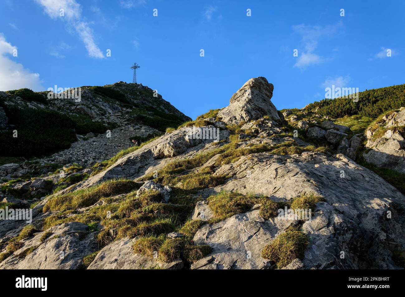 A cross on the top of the Giewont mountain rising above Zakopane in the ...